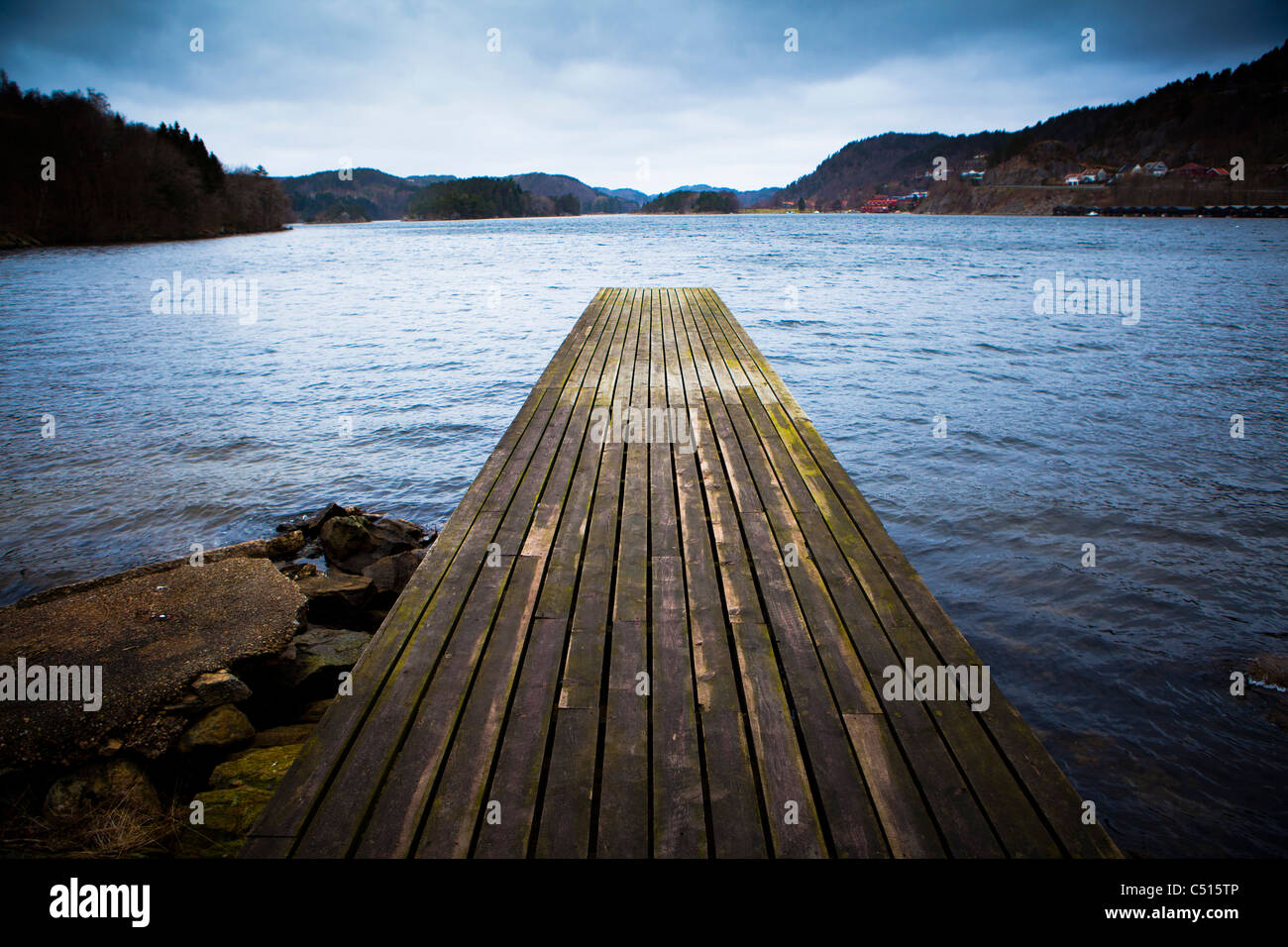 Wooden pier looking out onto lake and mountains Stock Photo - Alamy