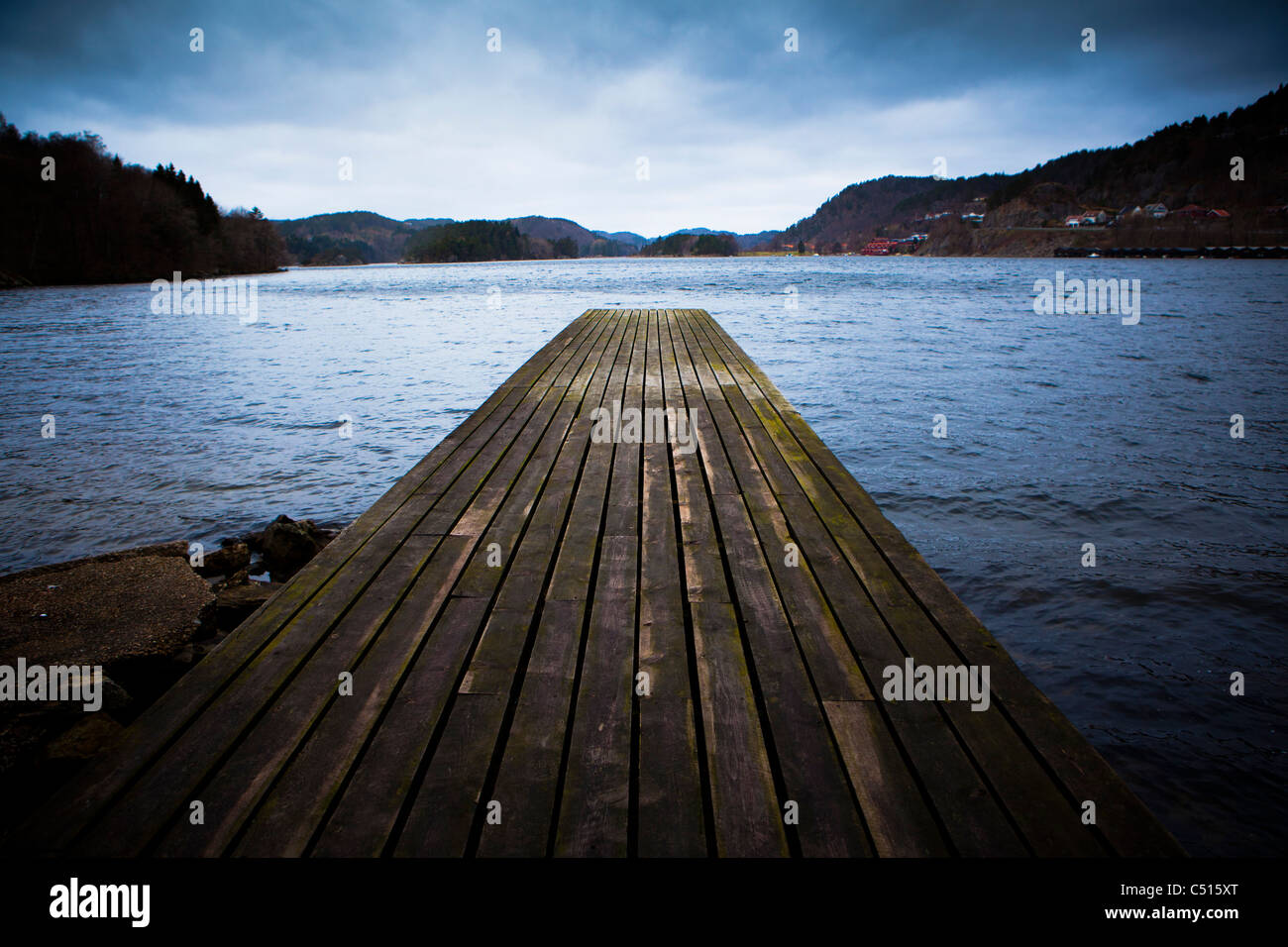 Wooden pier looking out onto lake and mountains Stock Photo - Alamy