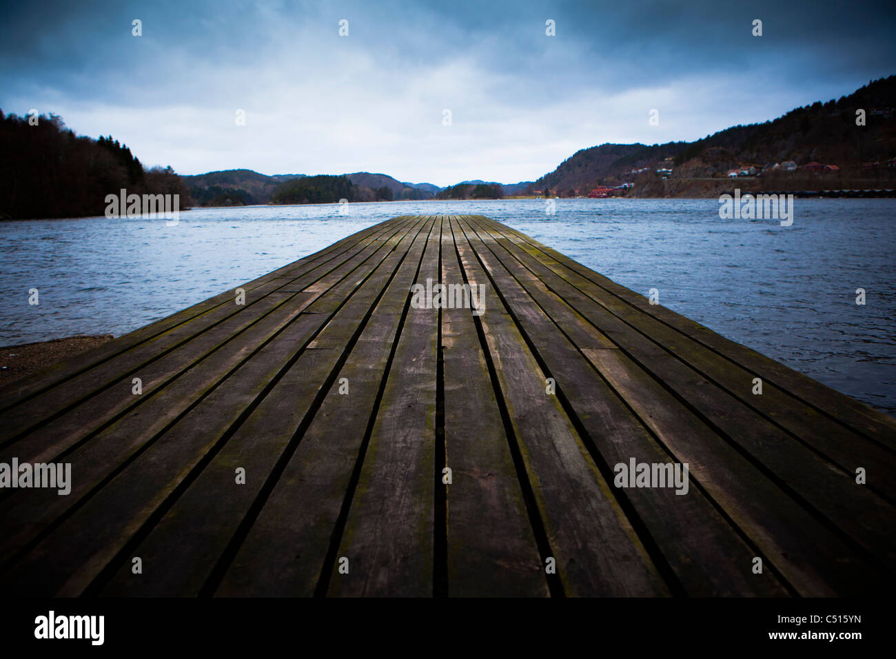 Wooden pier looking out onto lake and mountains Stock Photo - Alamy