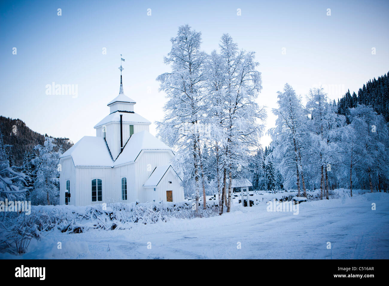 White church covered in snowy landscape Stock Photo - Alamy