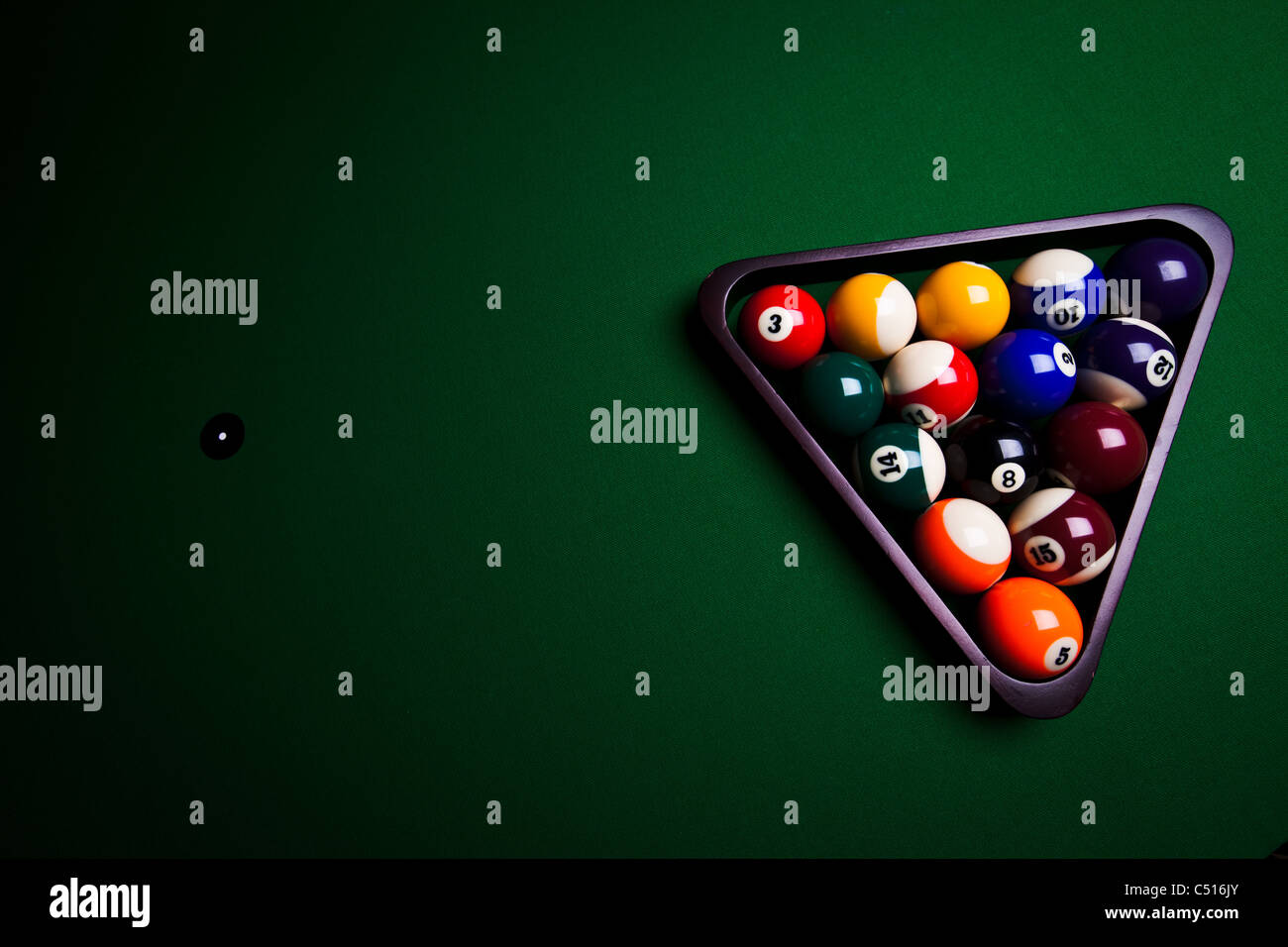 Billiard balls over green table Stock Photo - Alamy