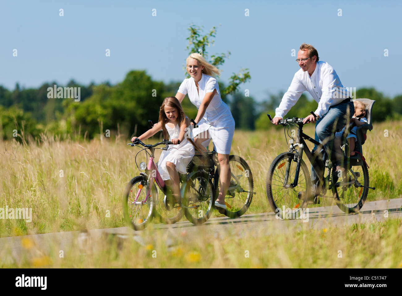 Family with baby and girl child having a weekend excursion on their ...