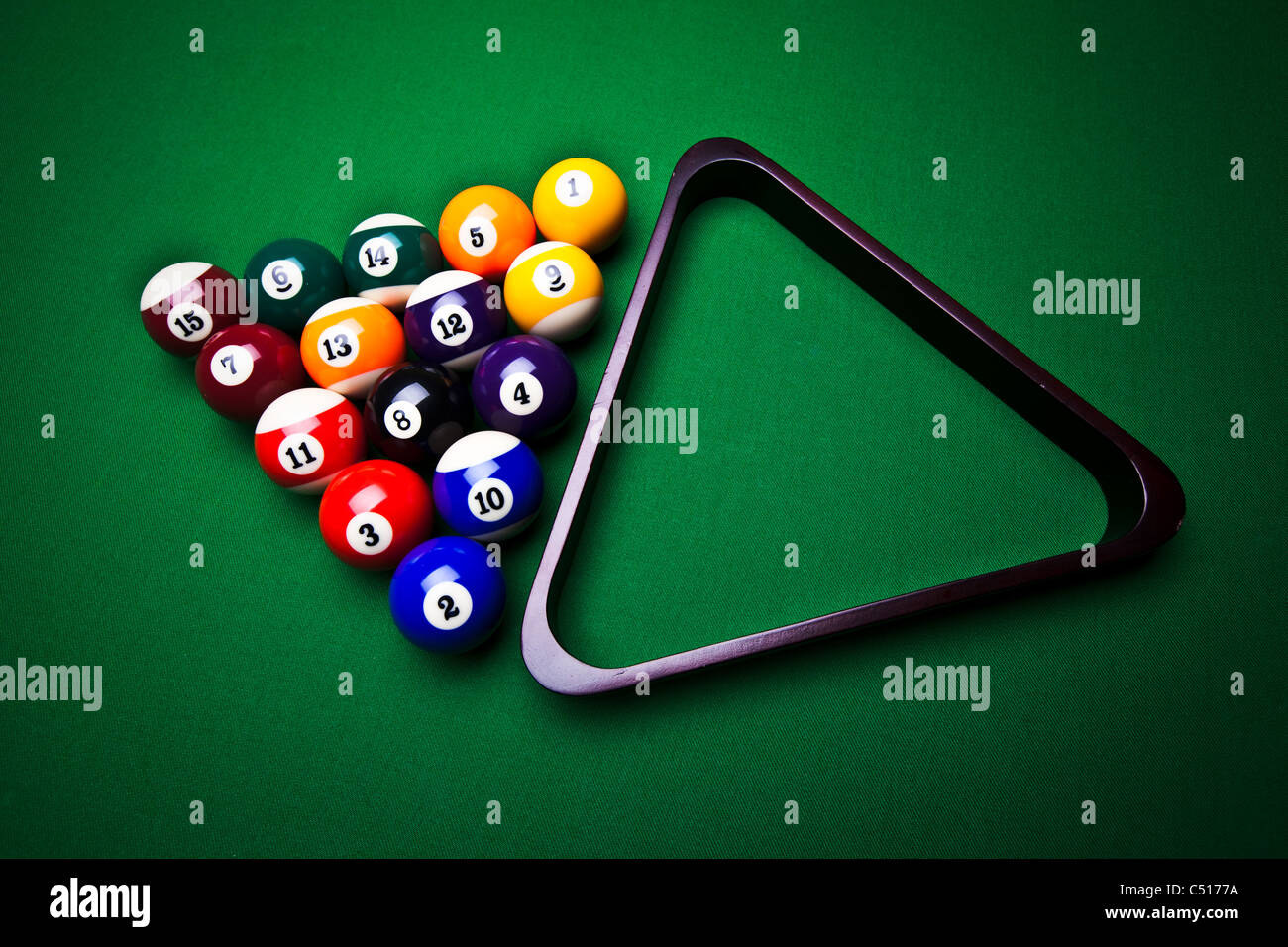 Billiard balls over green table Stock Photo - Alamy