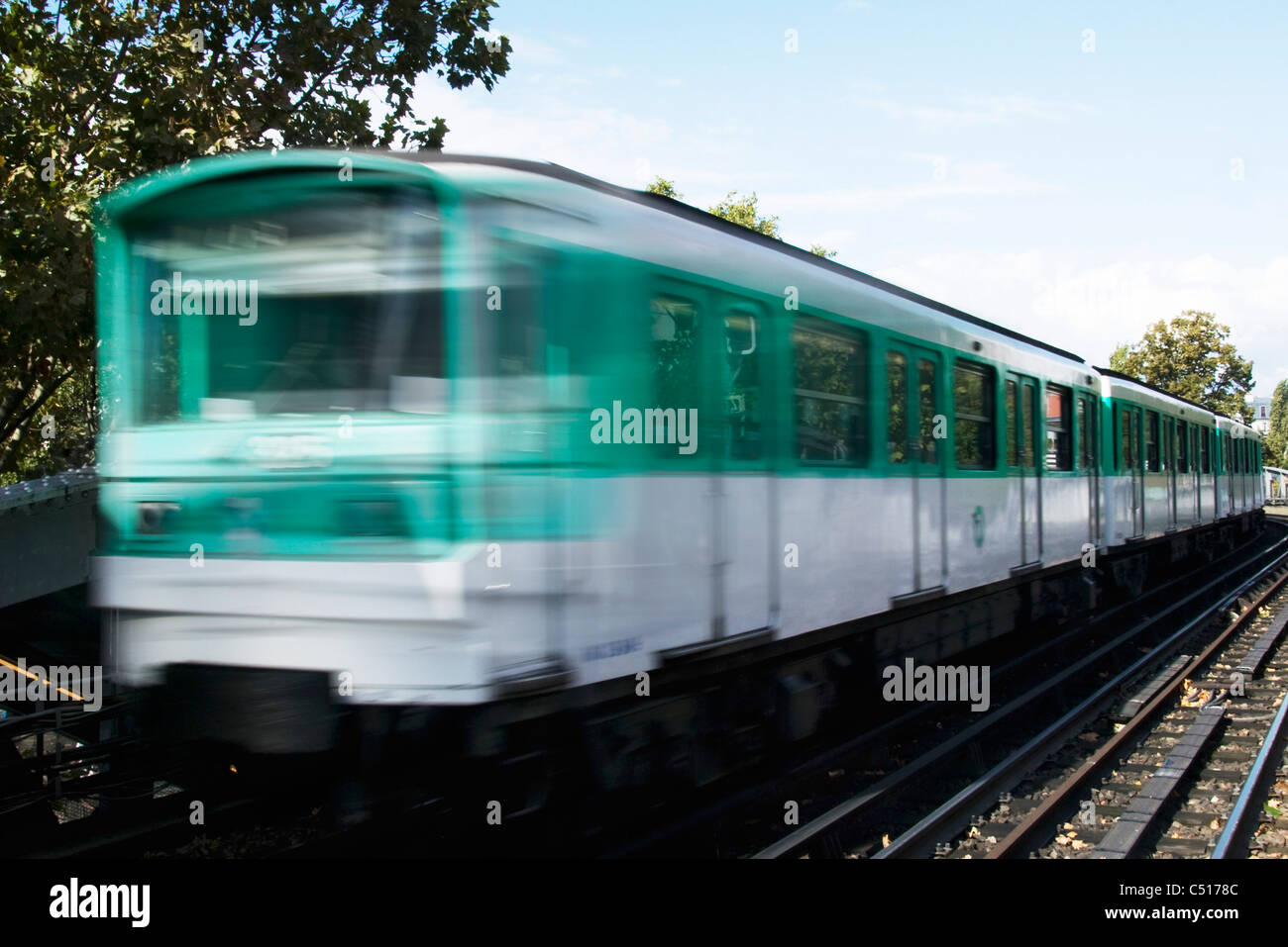 Train running on rail track Stock Photo - Alamy