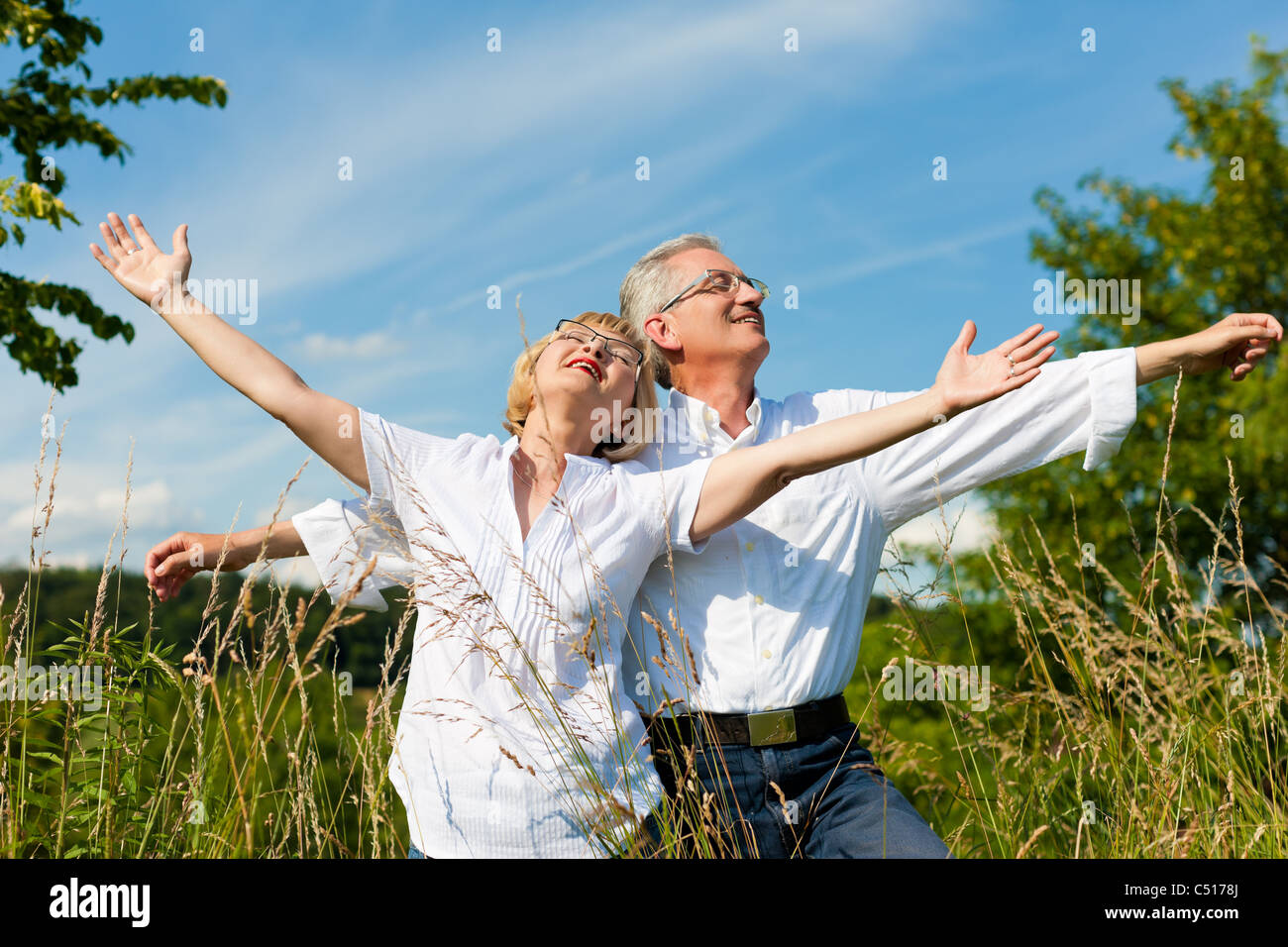 Happy mature couple - senior people (man and woman) already retired ...
