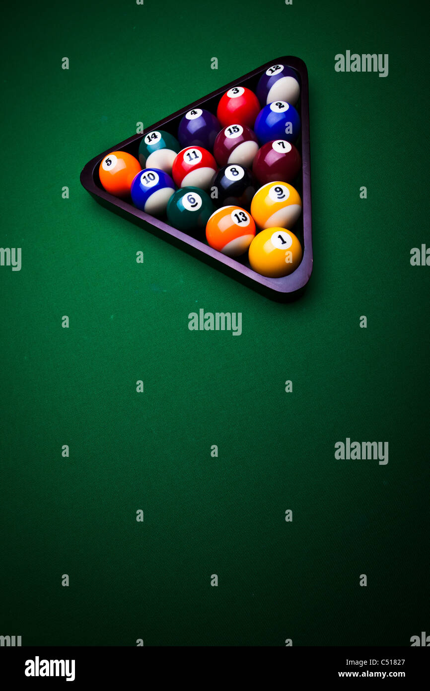 Billiard balls over green table Stock Photo - Alamy