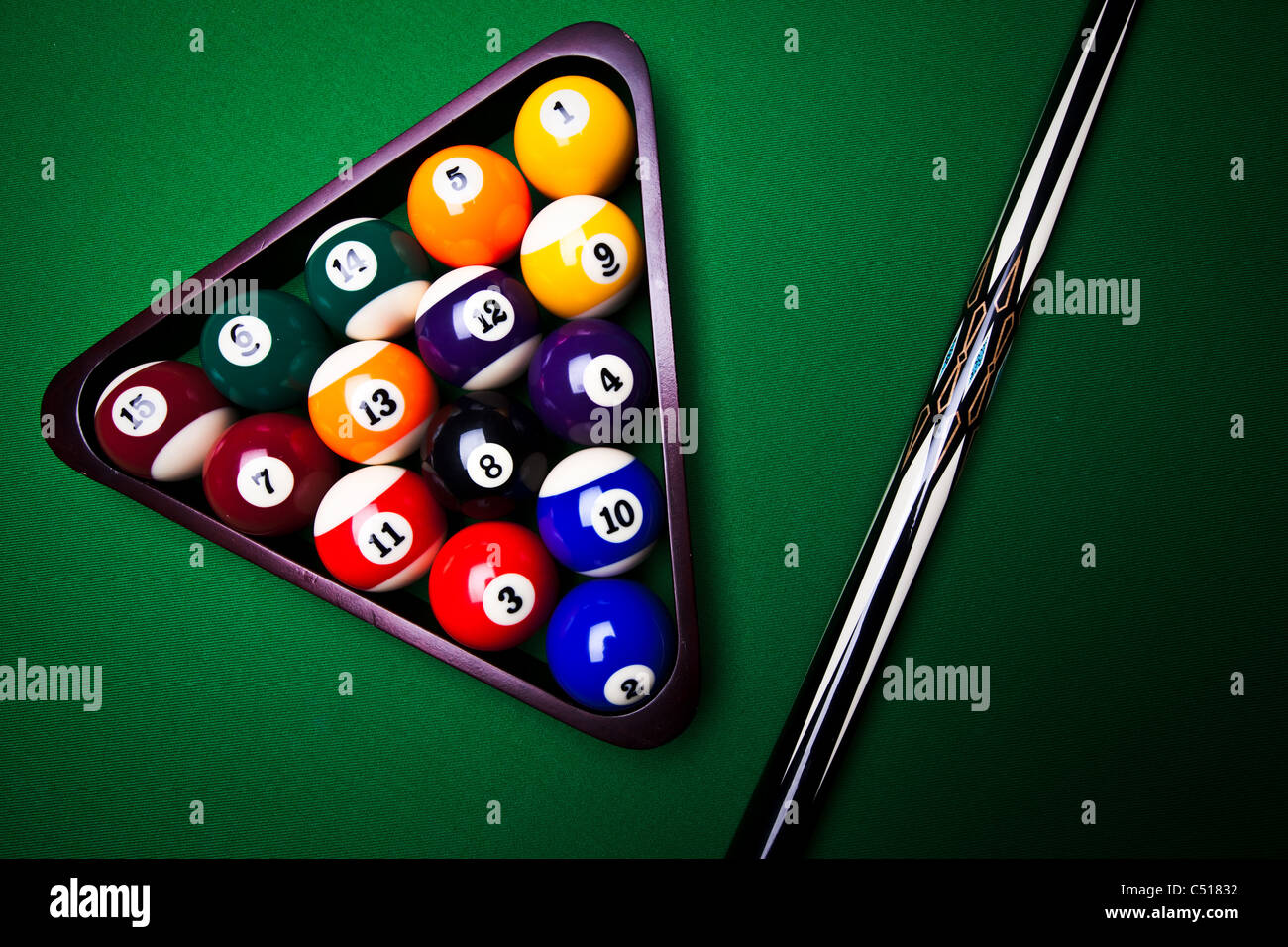 Billiard balls over green table Stock Photo - Alamy