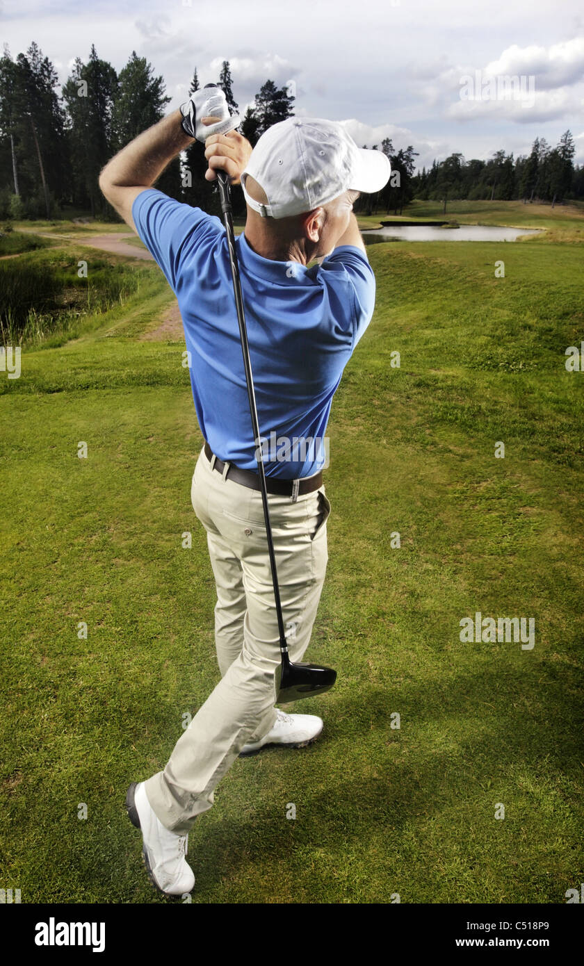 golfer shooting a golf ball Stock Photo - Alamy