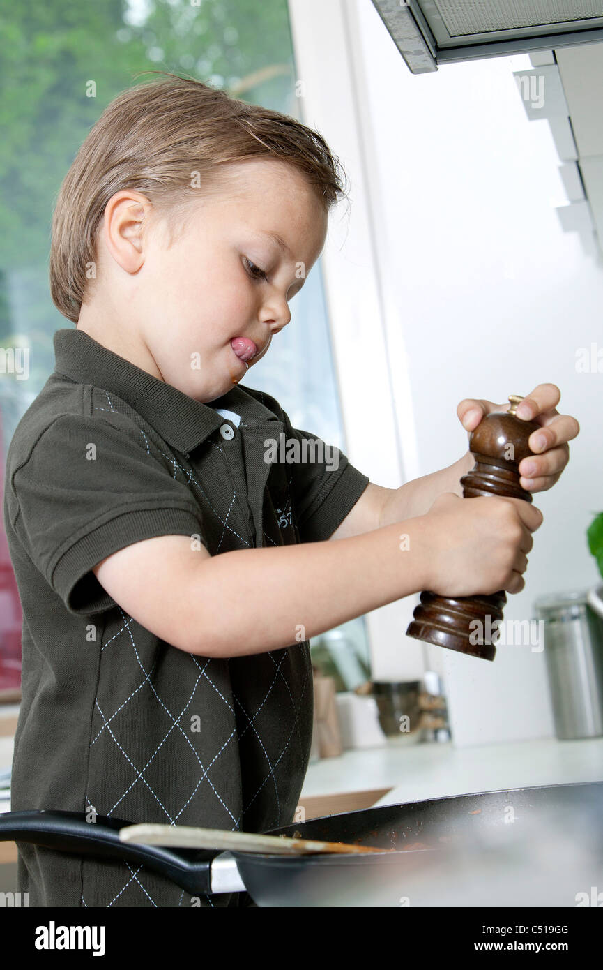 portrait of young boy cooking in kitchen Stock Photo - Alamy