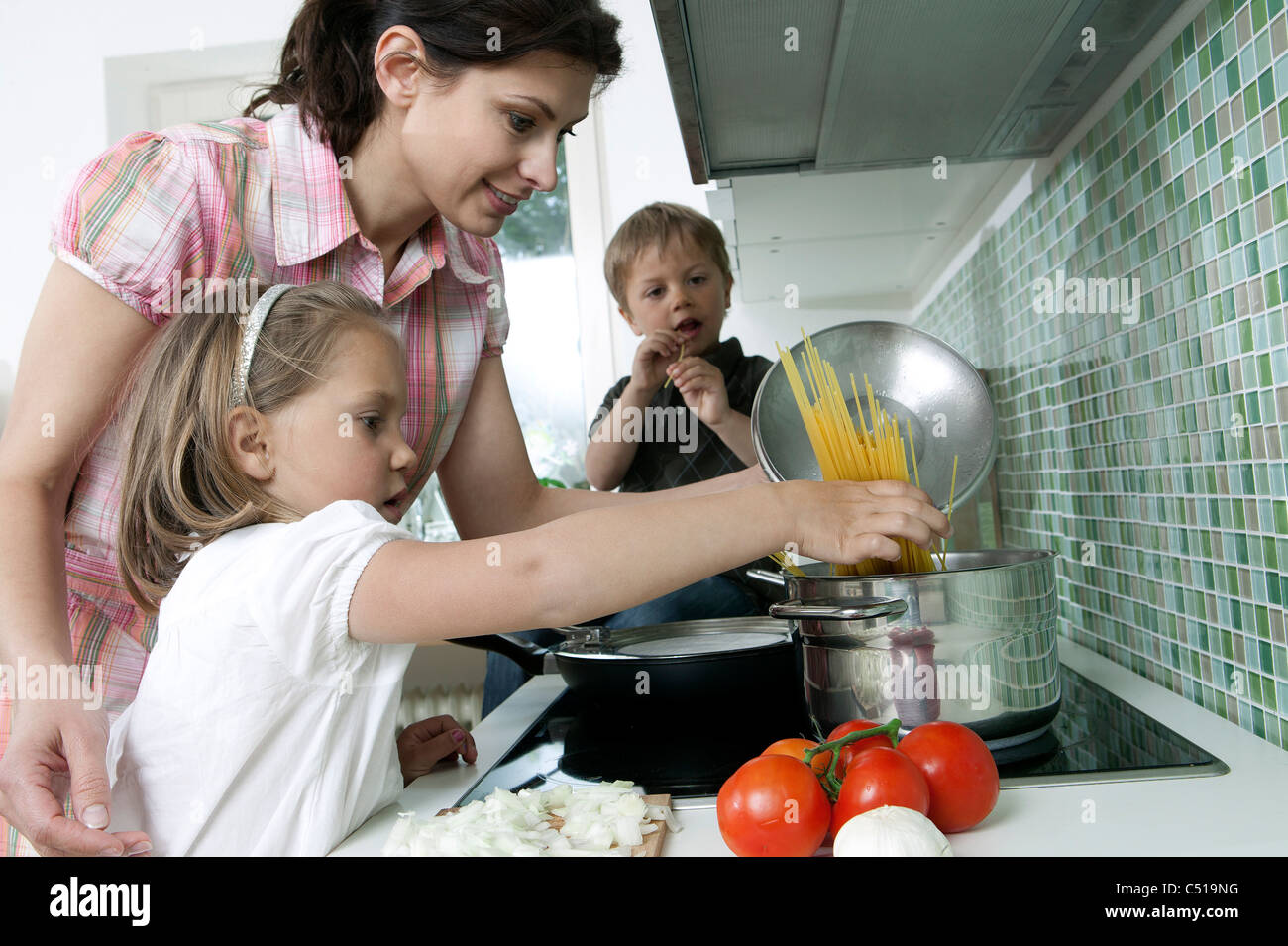 mother cooking with her children Stock Photo - Alamy
