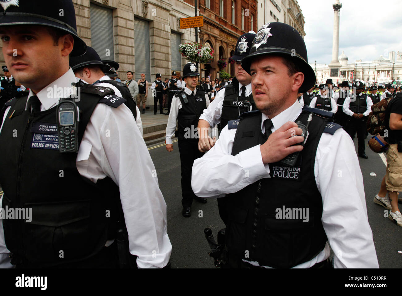 Police officers form lines to control protesters in Central London on a ...