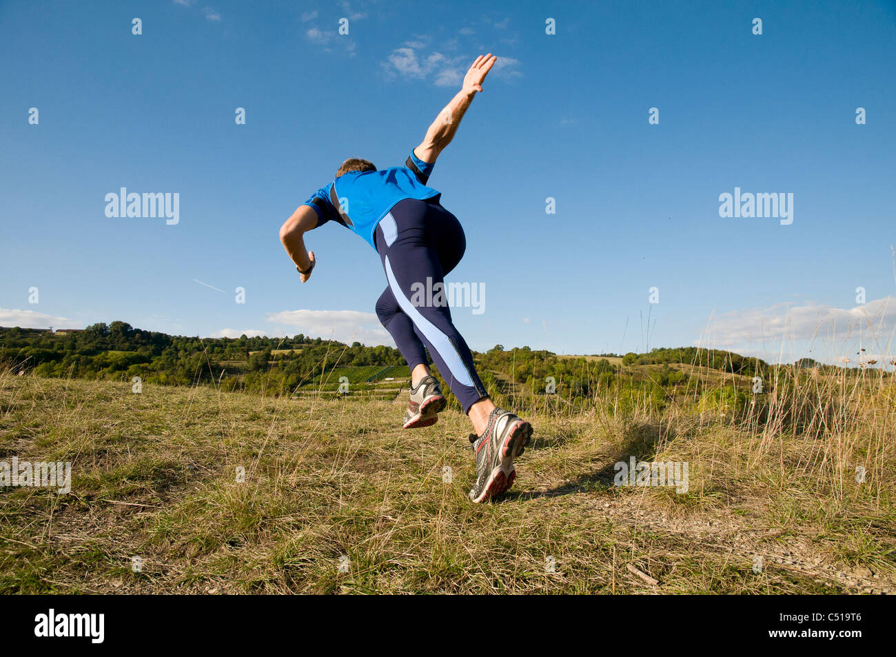 Runner at the start Stock Photo - Alamy