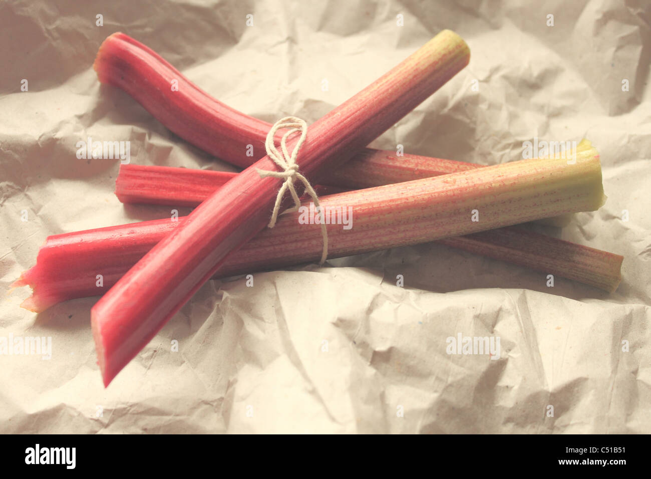 Rhubarb tied with String on a Brown Paper Background Stock Photo - Alamy