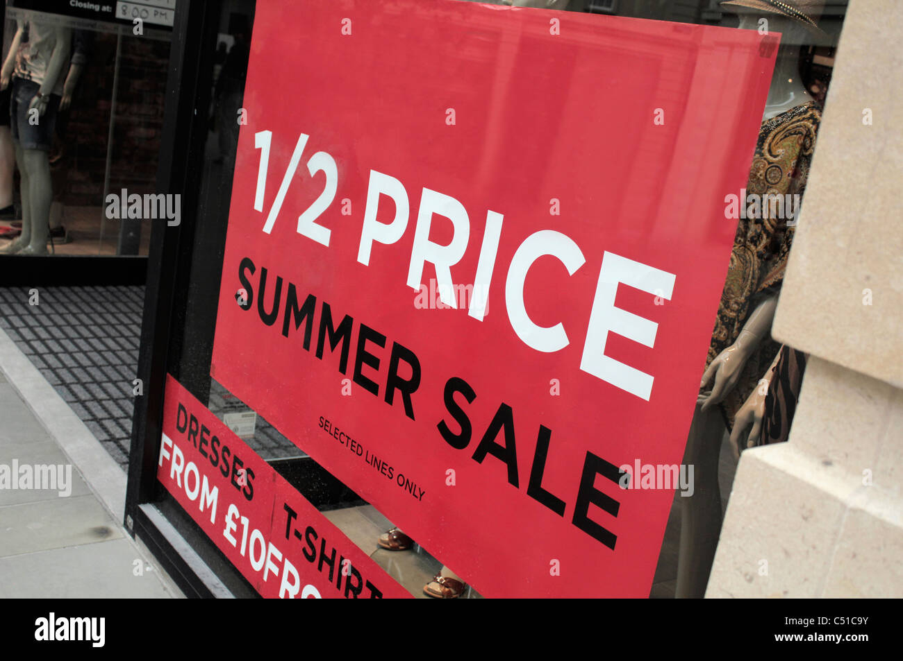 Sale sign in shop window Stock Photo - Alamy