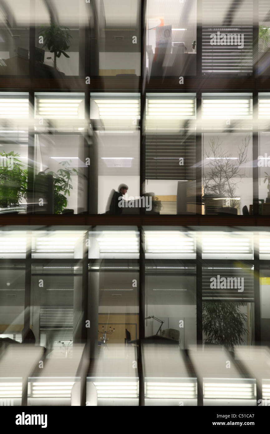 Illuminated windows of an office building, Berlin, Germany Stock Photo ...