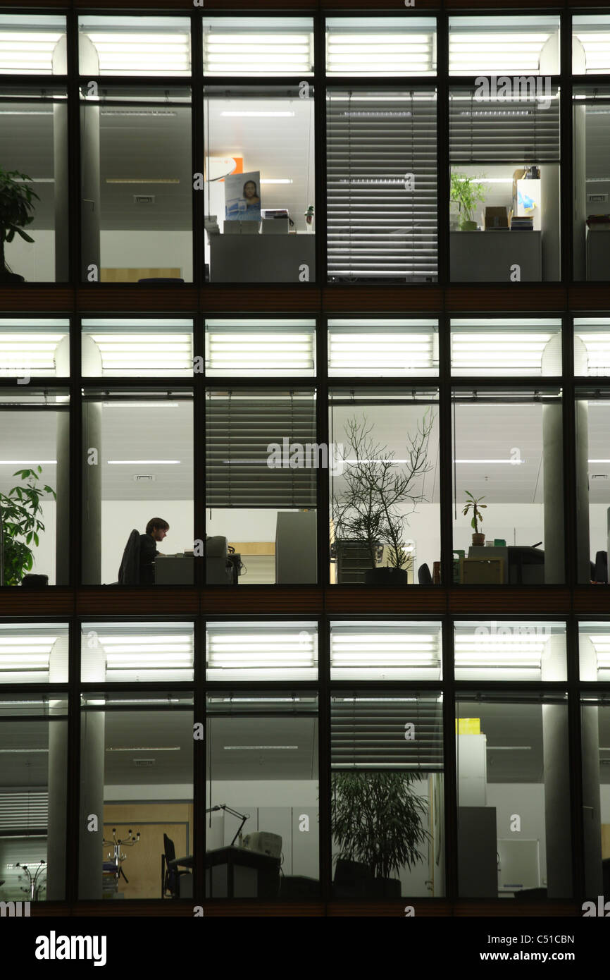 Illuminated windows of an office building, Berlin, Germany Stock Photo ...