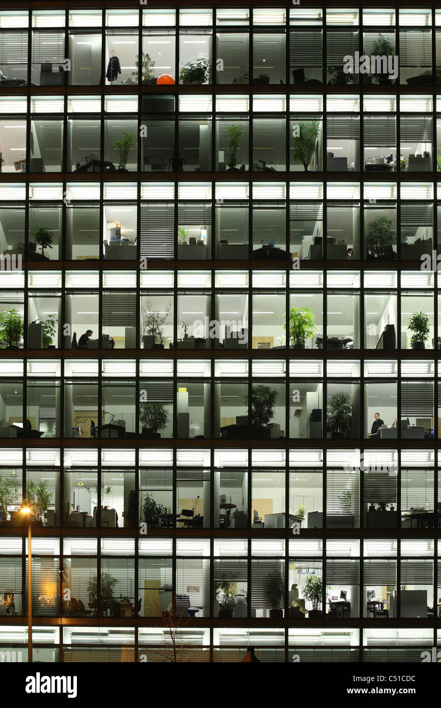 Illuminated windows of an office building, Berlin, Germany Stock Photo ...