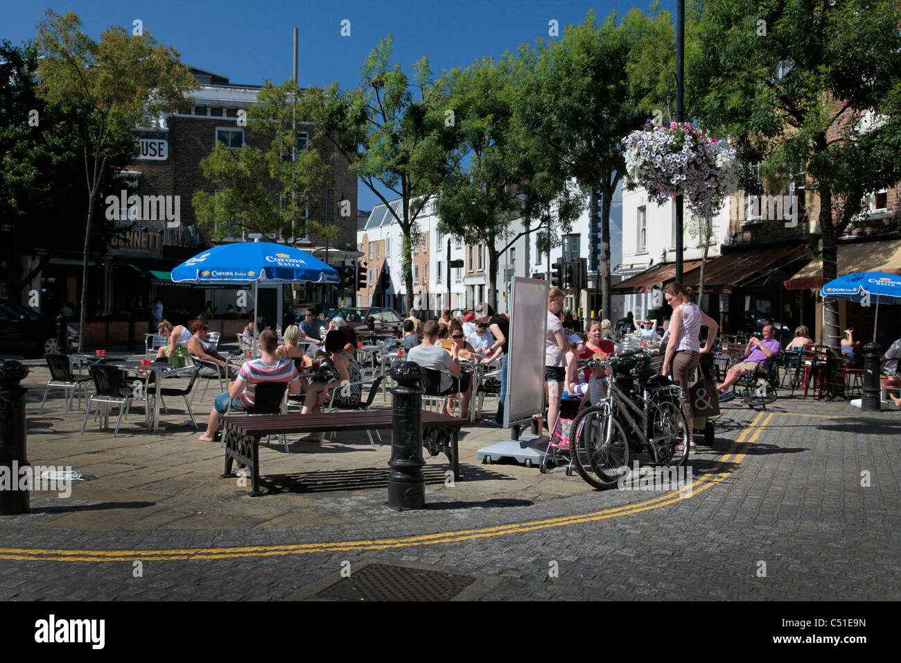 People enjoying the sunshine on Battersea Square, London, UK Stock ...