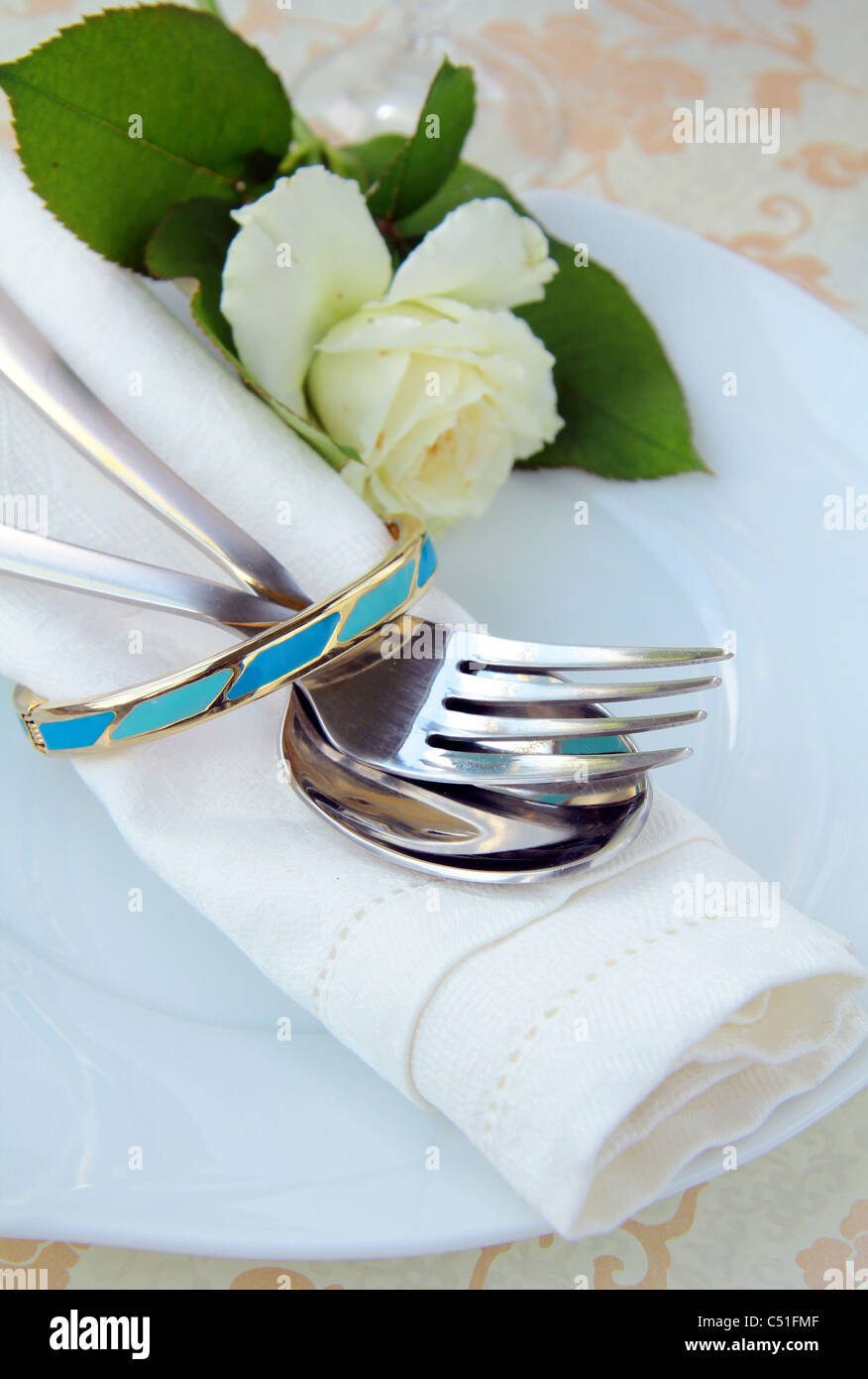 wedding table setting with a white rose Stock Photo - Alamy