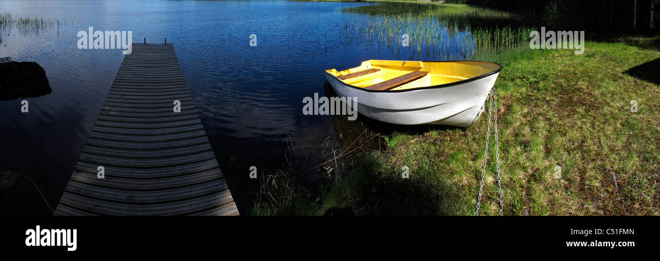 Scandinavia Finland finnish yellow boat idyllic on shore Stock Photo ...