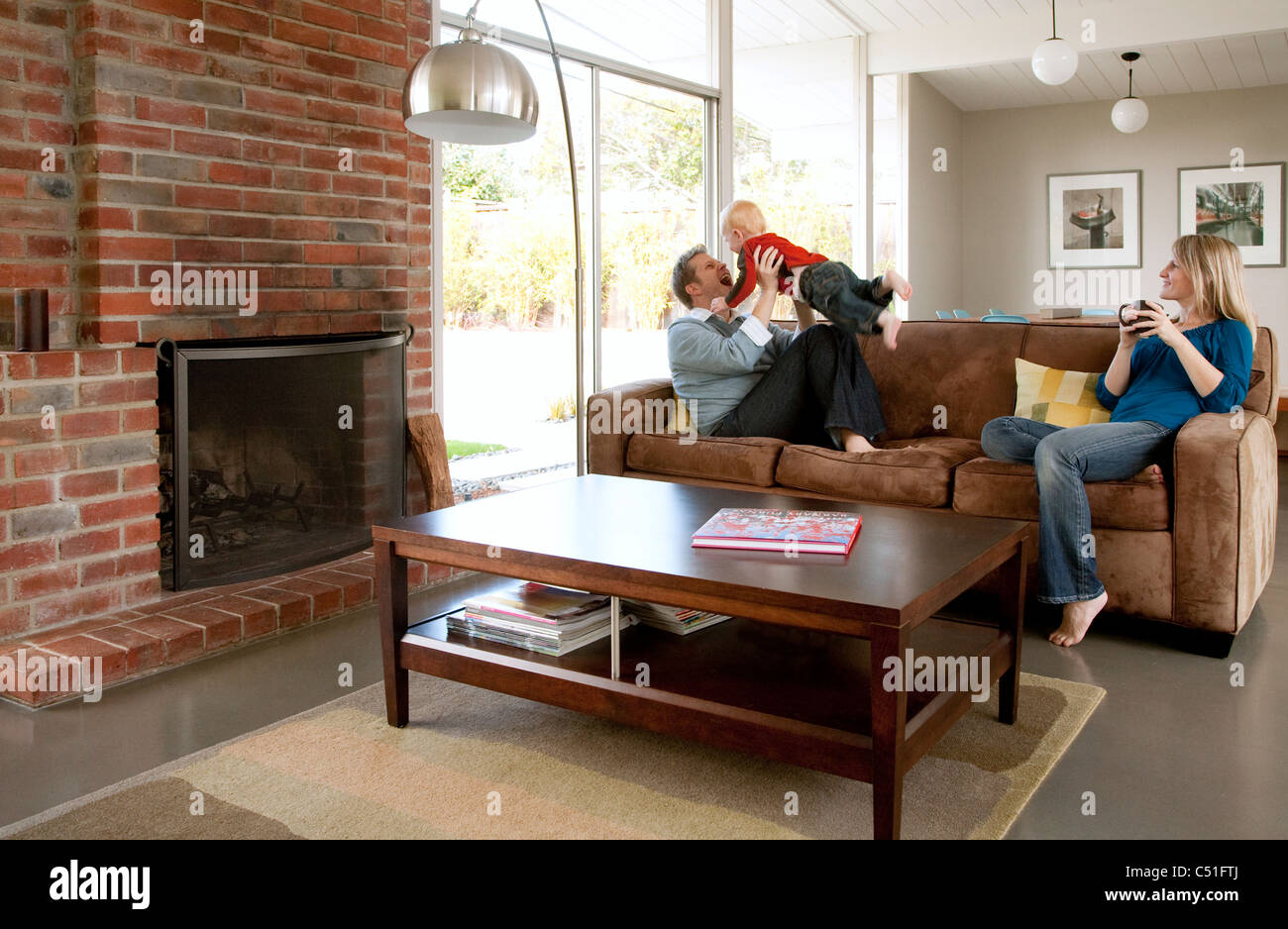 Father and son interacting in their living room Stock Photo - Alamy