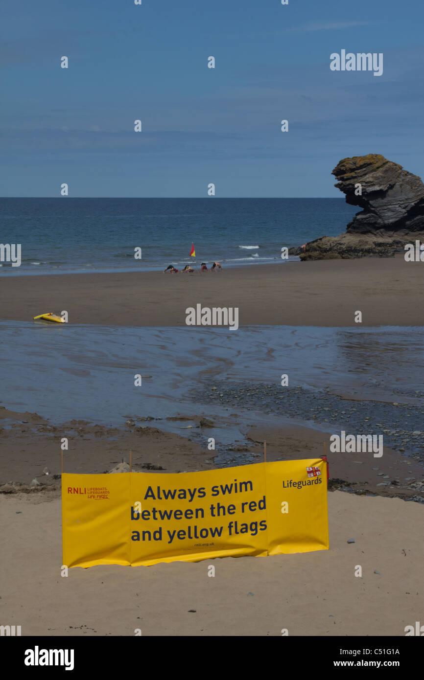 RNLI warning sign at Llangrannog Stock Photo - Alamy