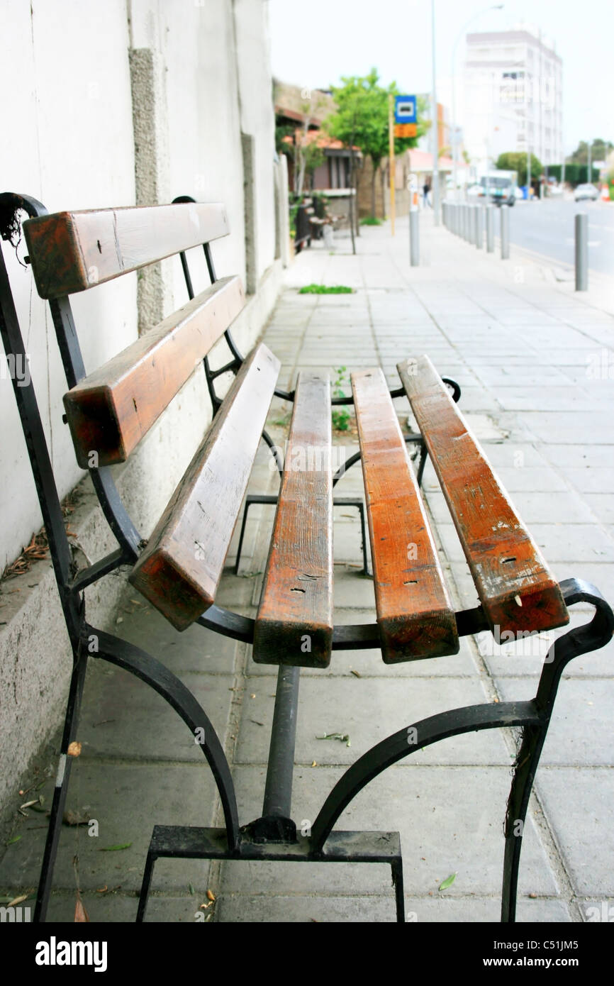 Alone bench in the street Stock Photo - Alamy