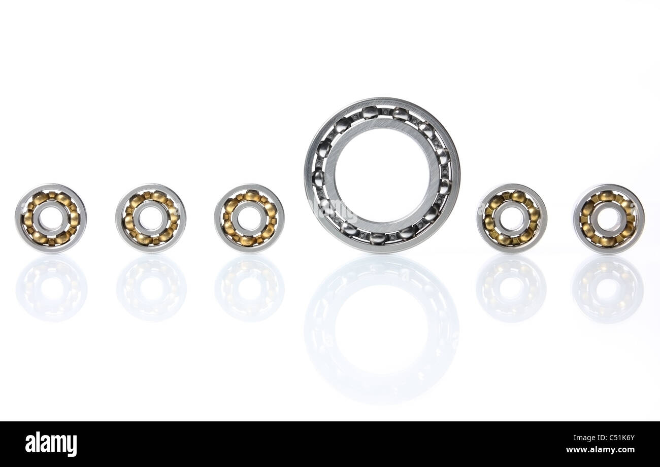 Six bearings standing in a row on a white background Stock Photo - Alamy