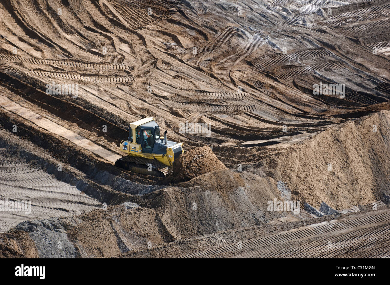 Earth moving construction equipment moving dirt Stock Photo - Alamy