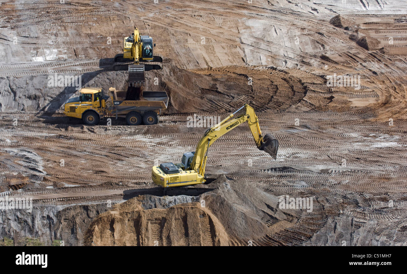 Earth moving construction equipment moving dirt Stock Photo - Alamy
