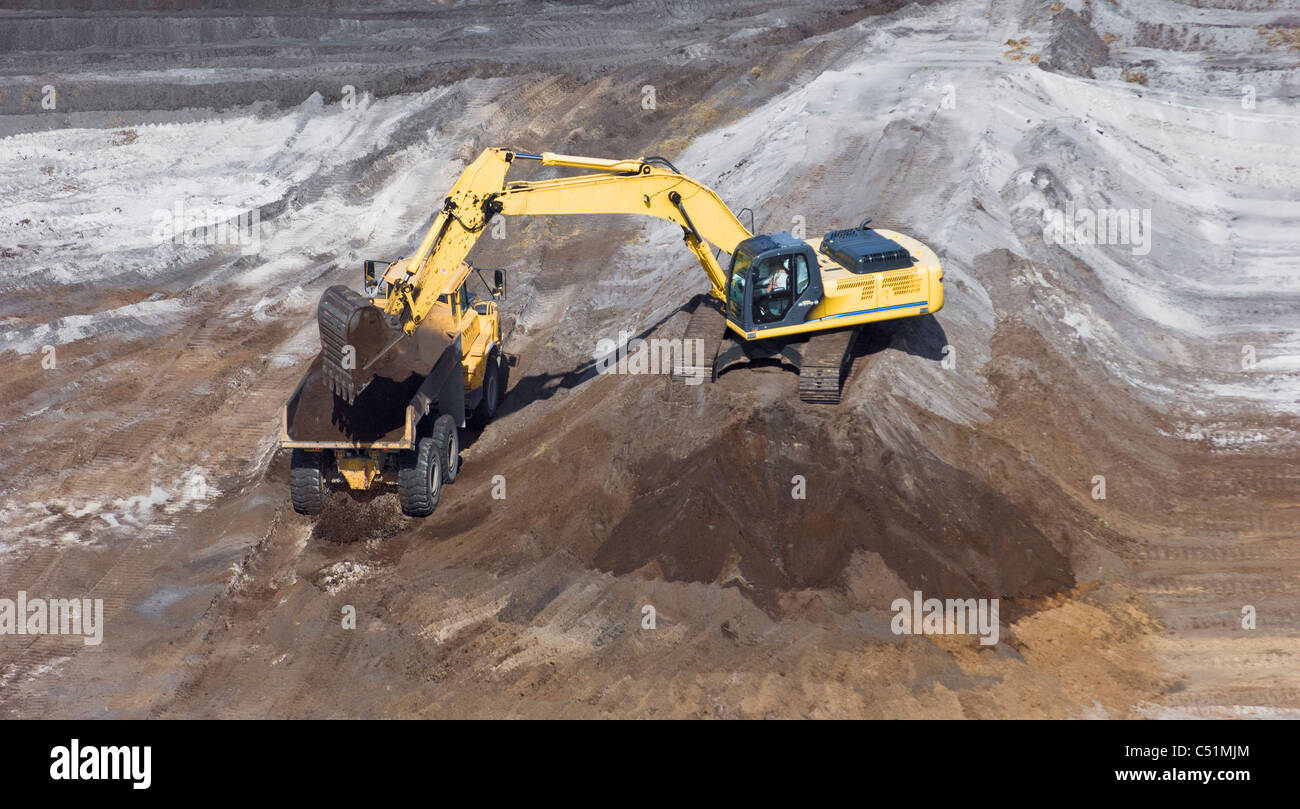 Earth moving construction equipment moving dirt Stock Photo - Alamy