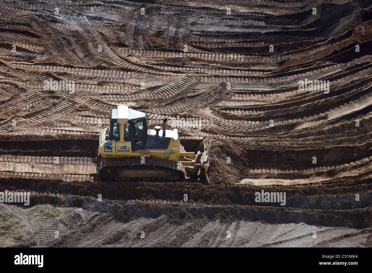 Earth moving construction equipment moving dirt Stock Photo - Alamy