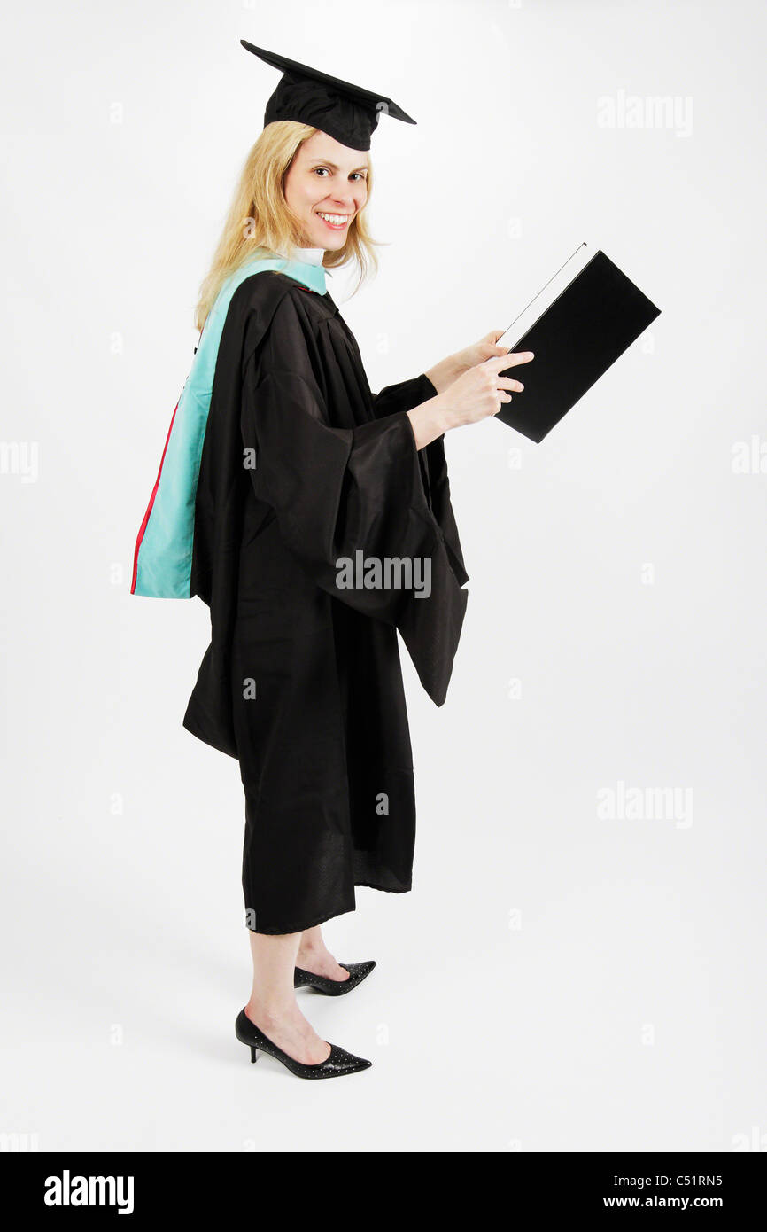 Young Woman Smiling While Holding a Graduate Degree Diploma Stock Photo ... Young Woman Smiling While Holding a Graduate Degree Diploma Stock Photo ...