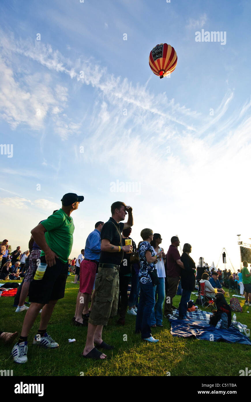 A hot air balloon floats over Hop Farm Festival, Hop Farm, Kent on 1st ...