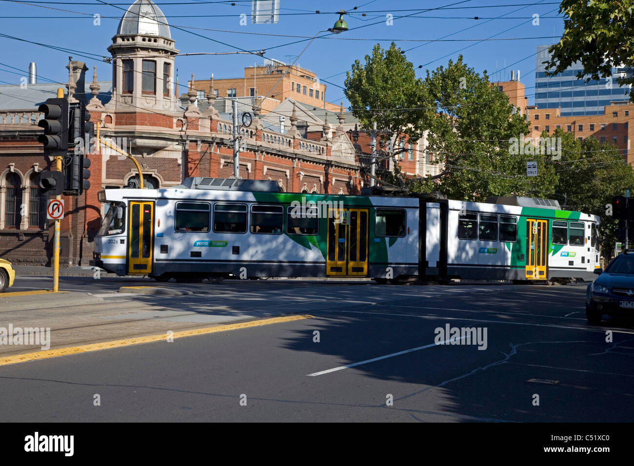 Electric Tram in Melbourne, Victoria. Crossing the intersection ...