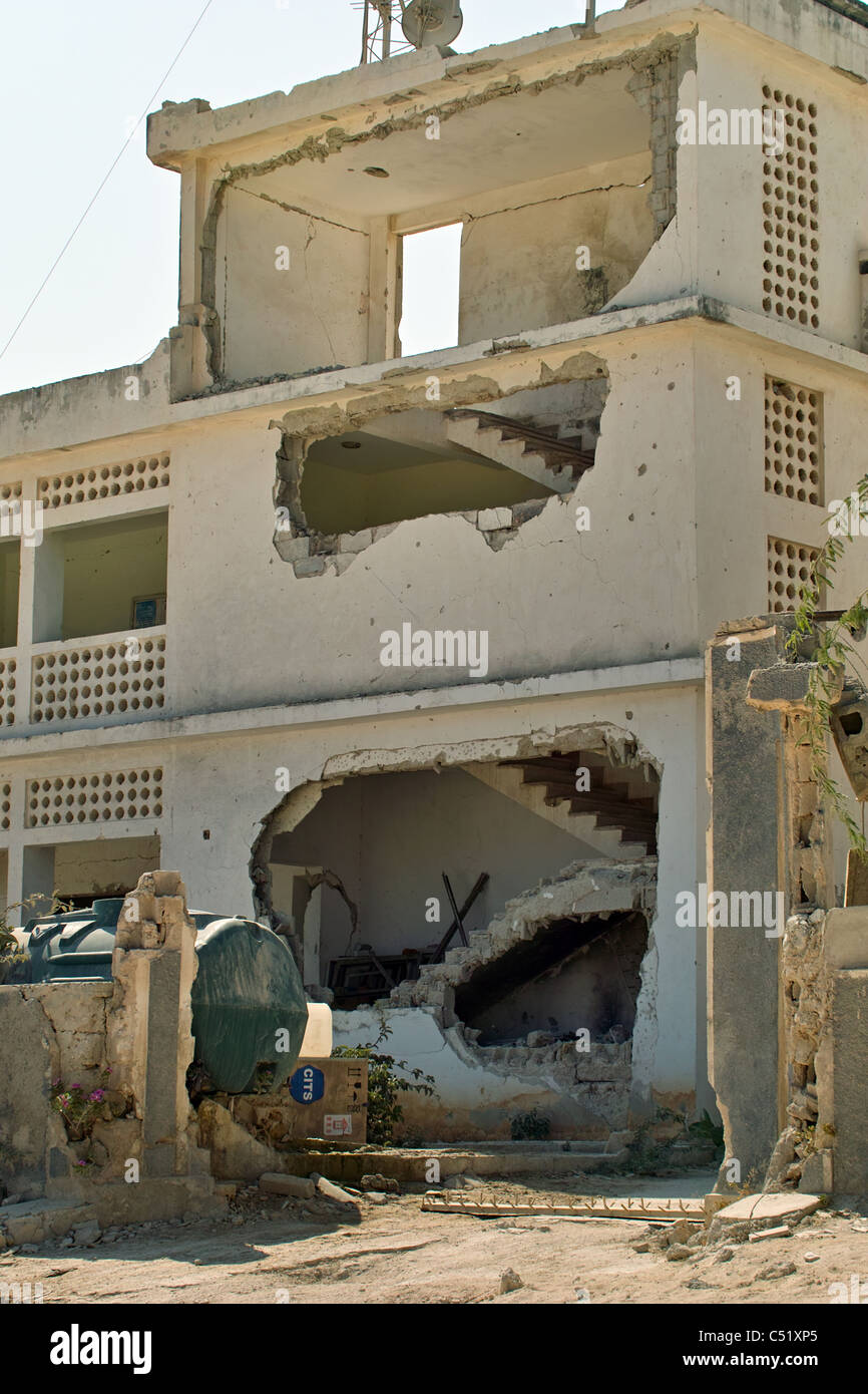 bombed out 3 floor building front revealing inner stair case Stock ...