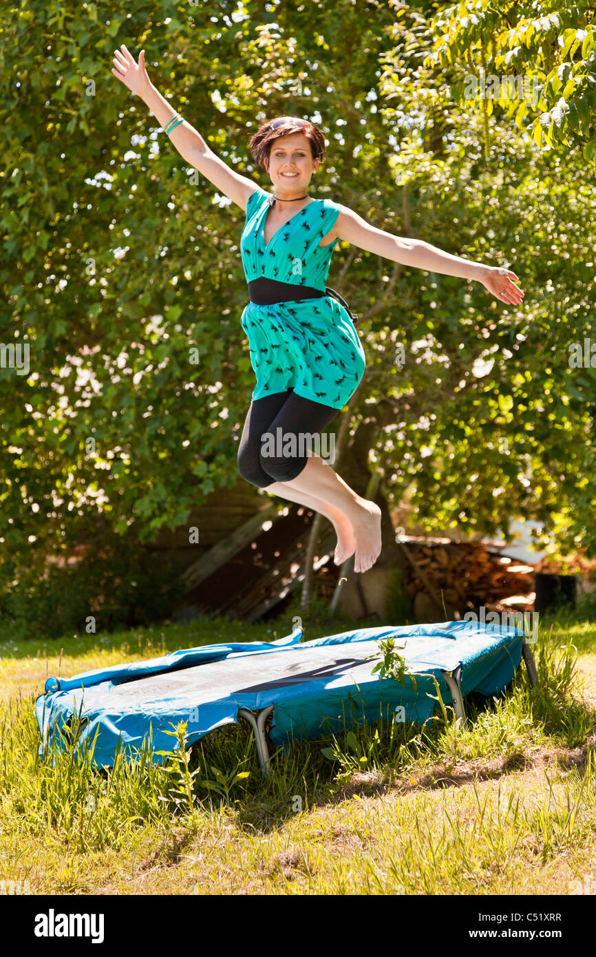 Trampoline jump woman High Resolution Stock Photography and Images - Alamy