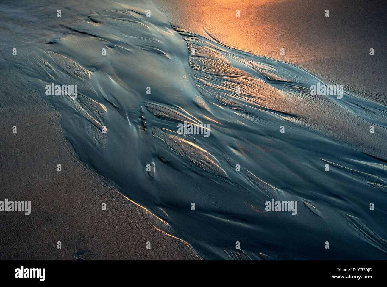 Patterns in the sand as the sun sets Stock Photo - Alamy