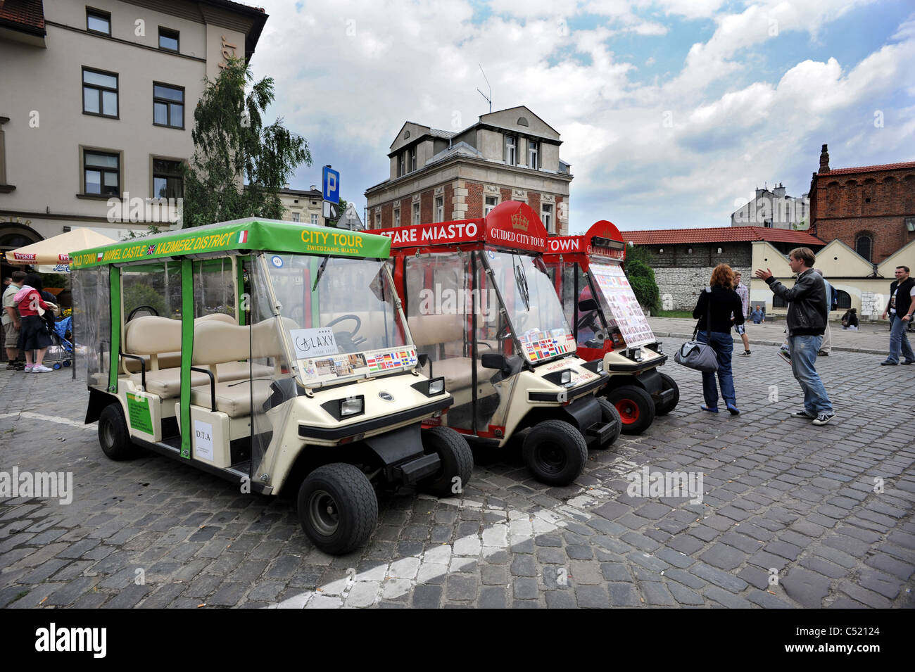 Electric tourist cars lined up in the Kazimierz, the old Jewish quarter ...