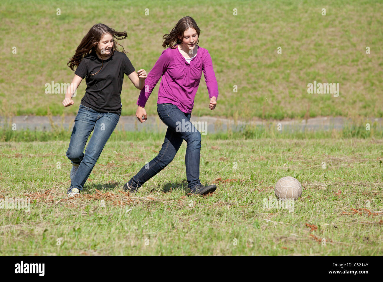 teenage girls playing football Stock Photo - Alamy