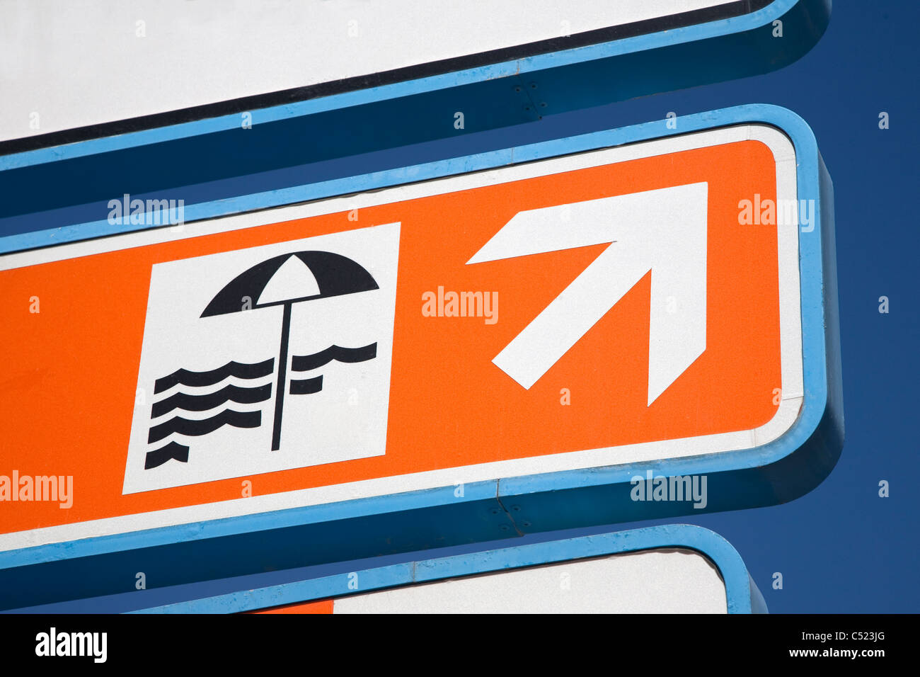 Orange Beach Traffic Road Sign against Blue Sky Background Stock Photo ...