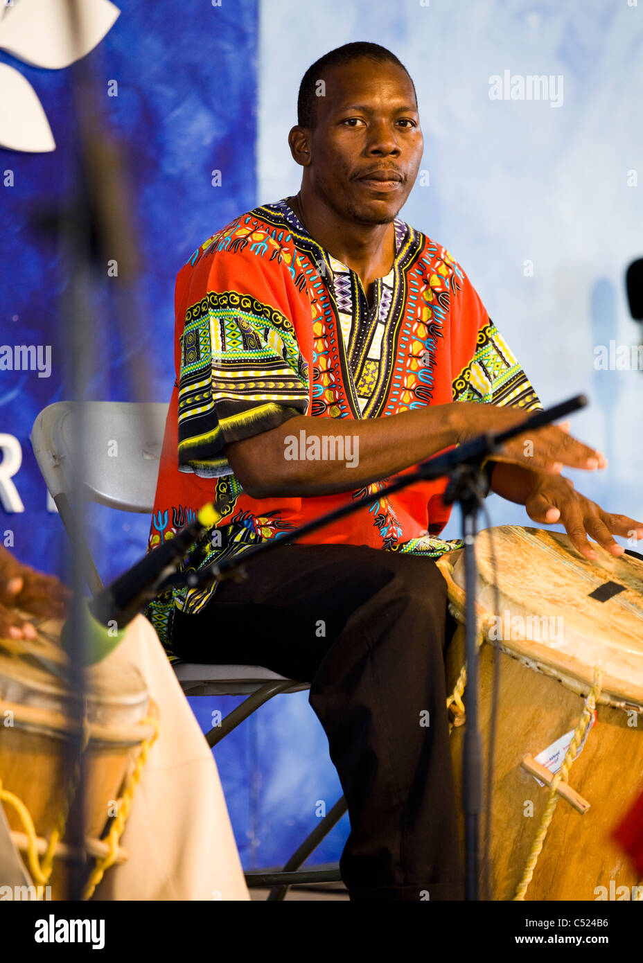 A Garifuna conga player on stage Stock Photo - Alamy