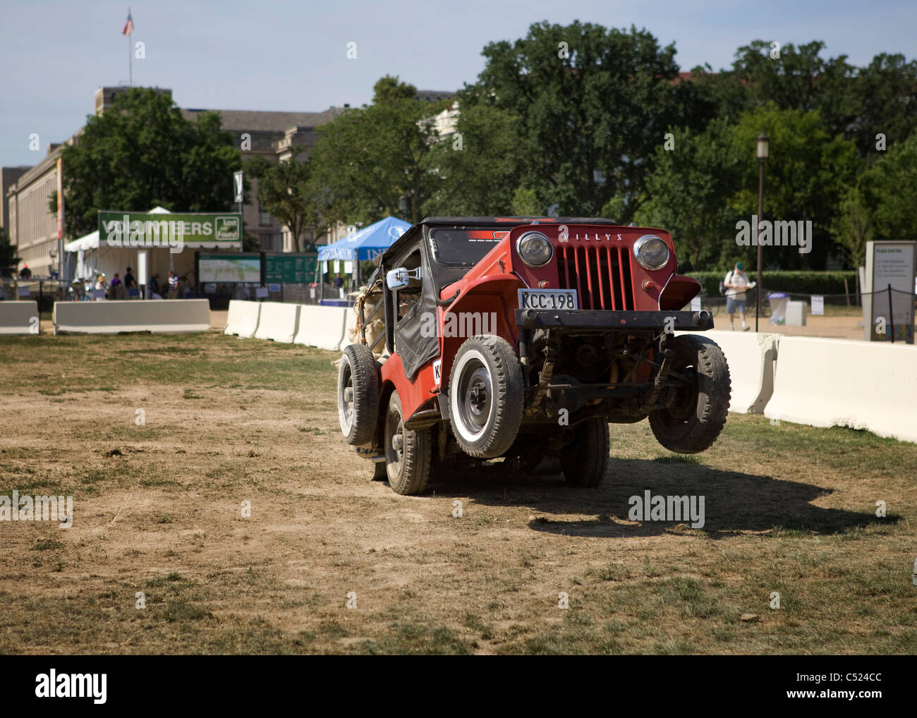 Overloaded Willys M38 Jeep with its front wheels up in the air Stock ...