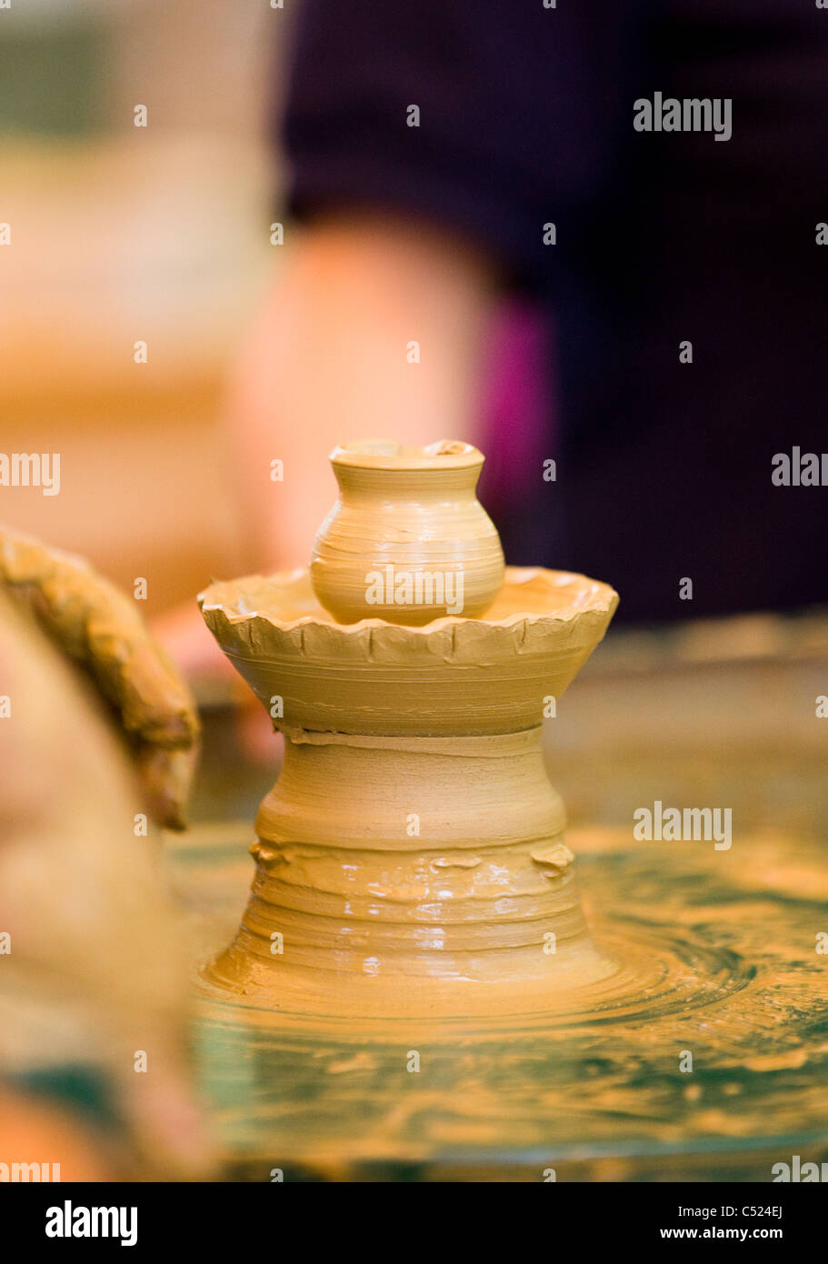 Closeup of pottery turning on wheel Stock Photo - Alamy