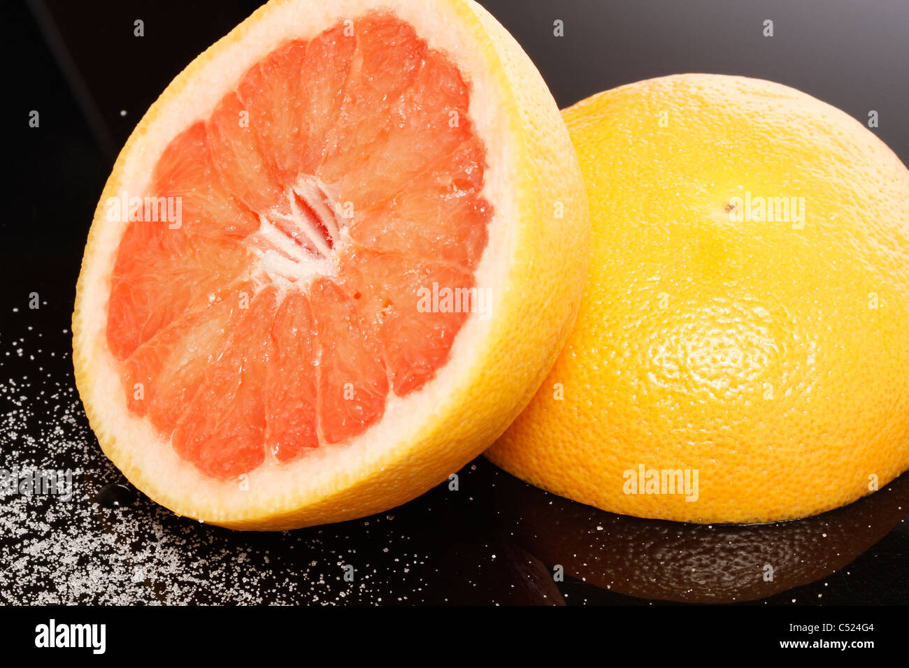 Grapefruit cut in half Stock Photo - Alamy