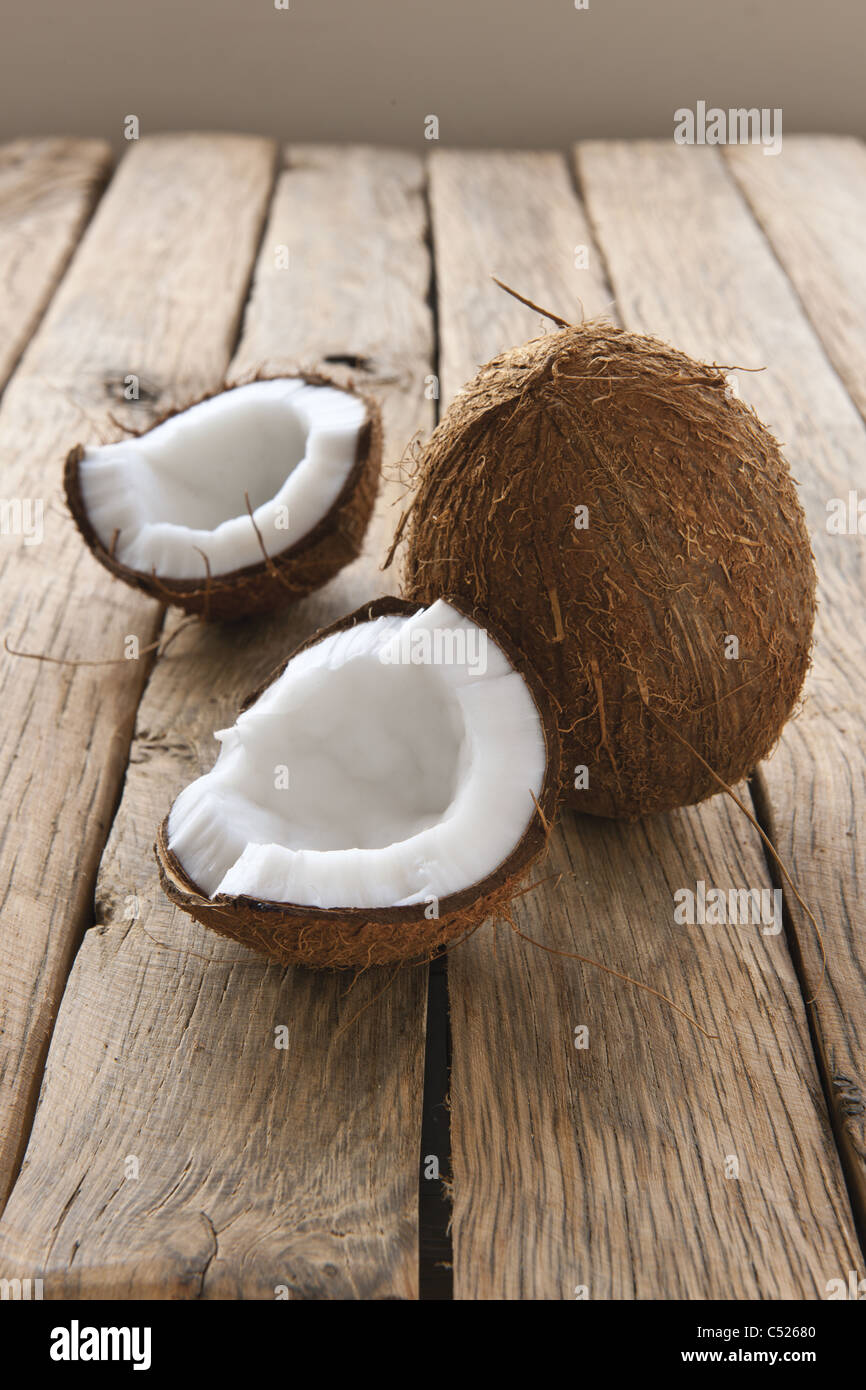 Coconut cracked open Stock Photo - Alamy