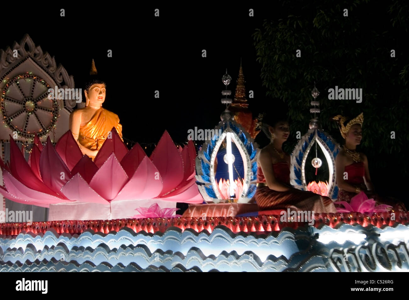 A beautiful and elaborate parade float displays traditional Thai ...