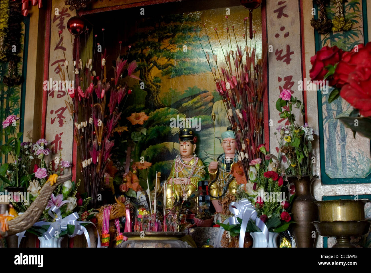 Buddha statues are on display inside a Buddhist temple in Thailand ...
