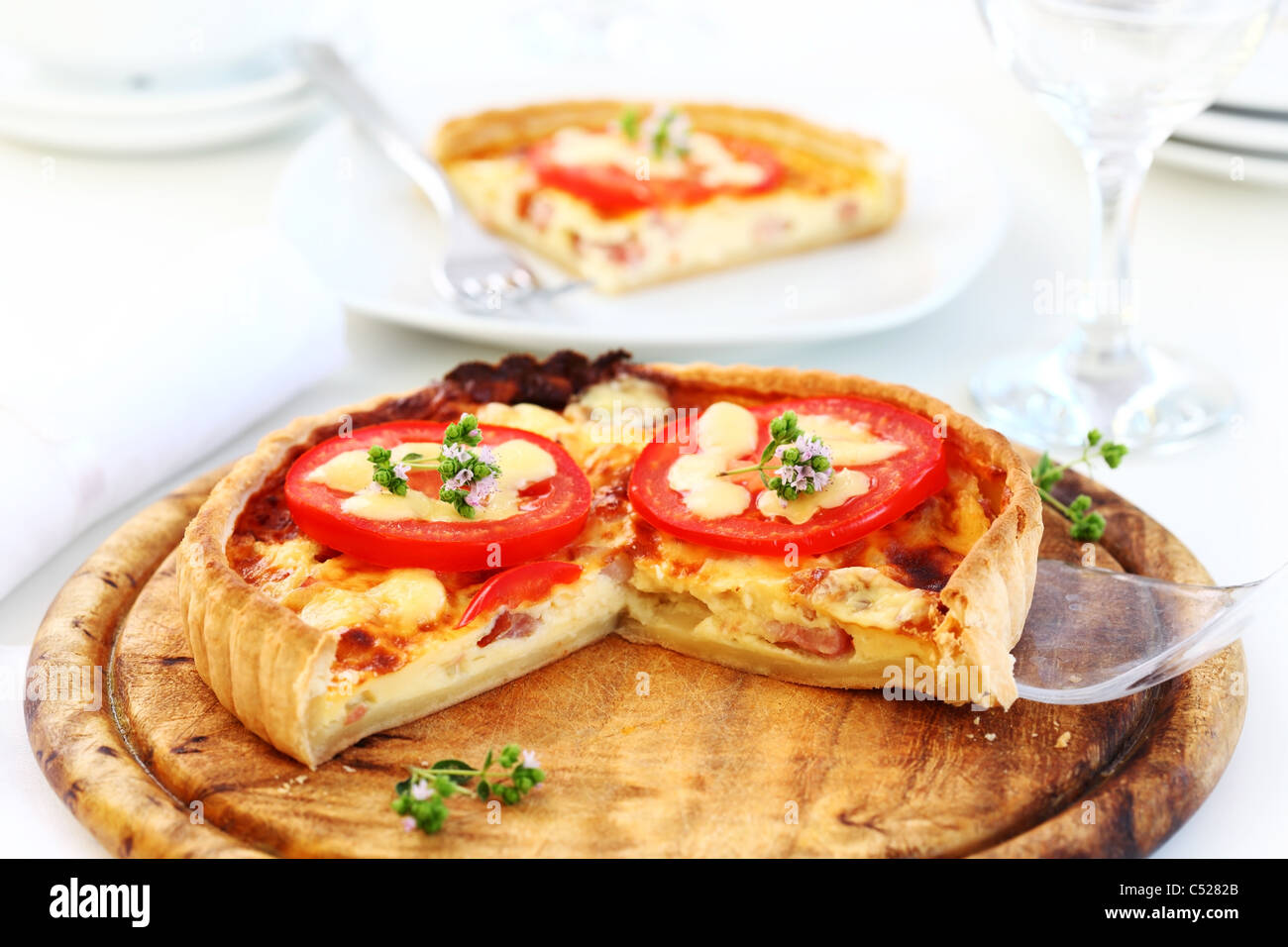 Tradition French bacon quiche with onion, tomato and cheese Stock Photo ...