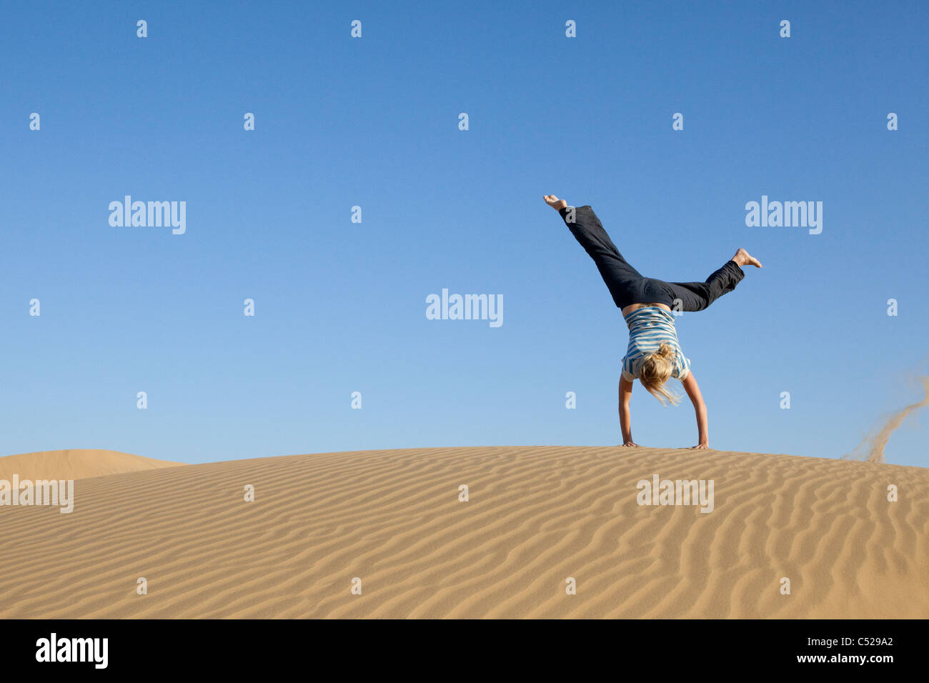 Girl Cartwheeling High Resolution Stock Photography and Images - Alamy